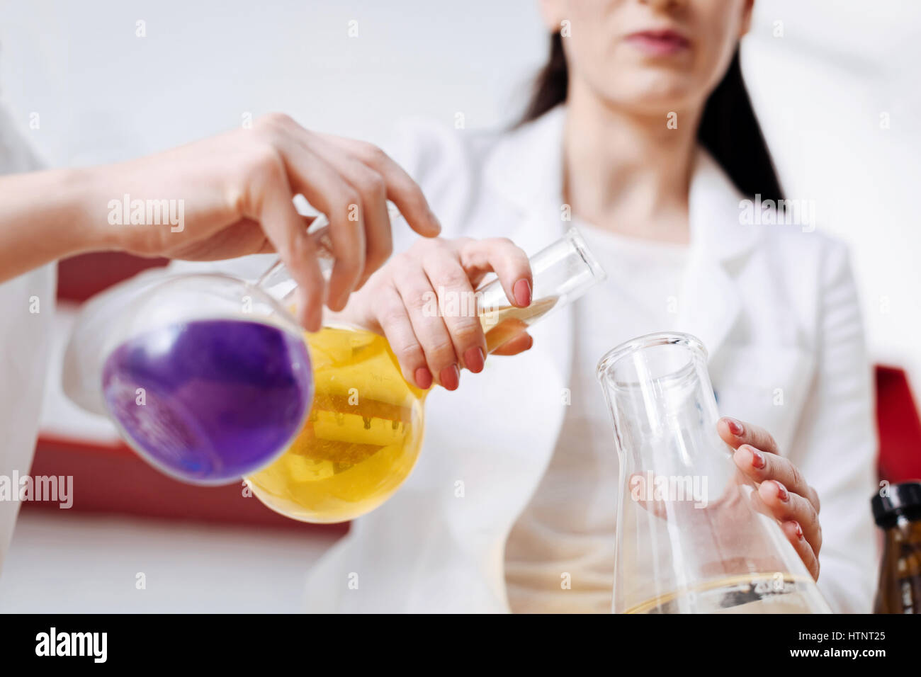 Chemical lab. Close up of flasks filled with different reagents and ...