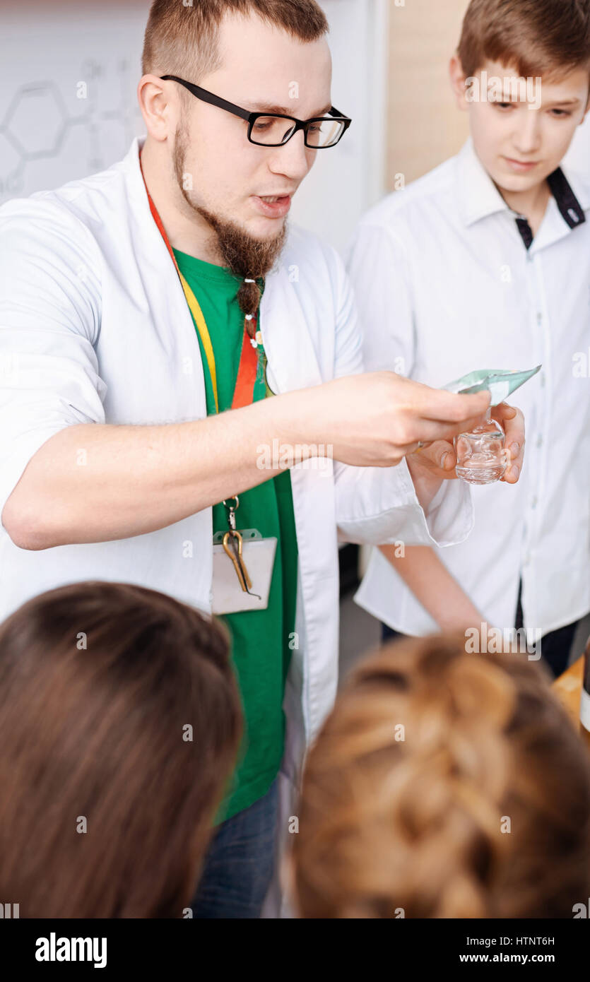 For gifted children. Smart intelligent male scientist wearing a white ...