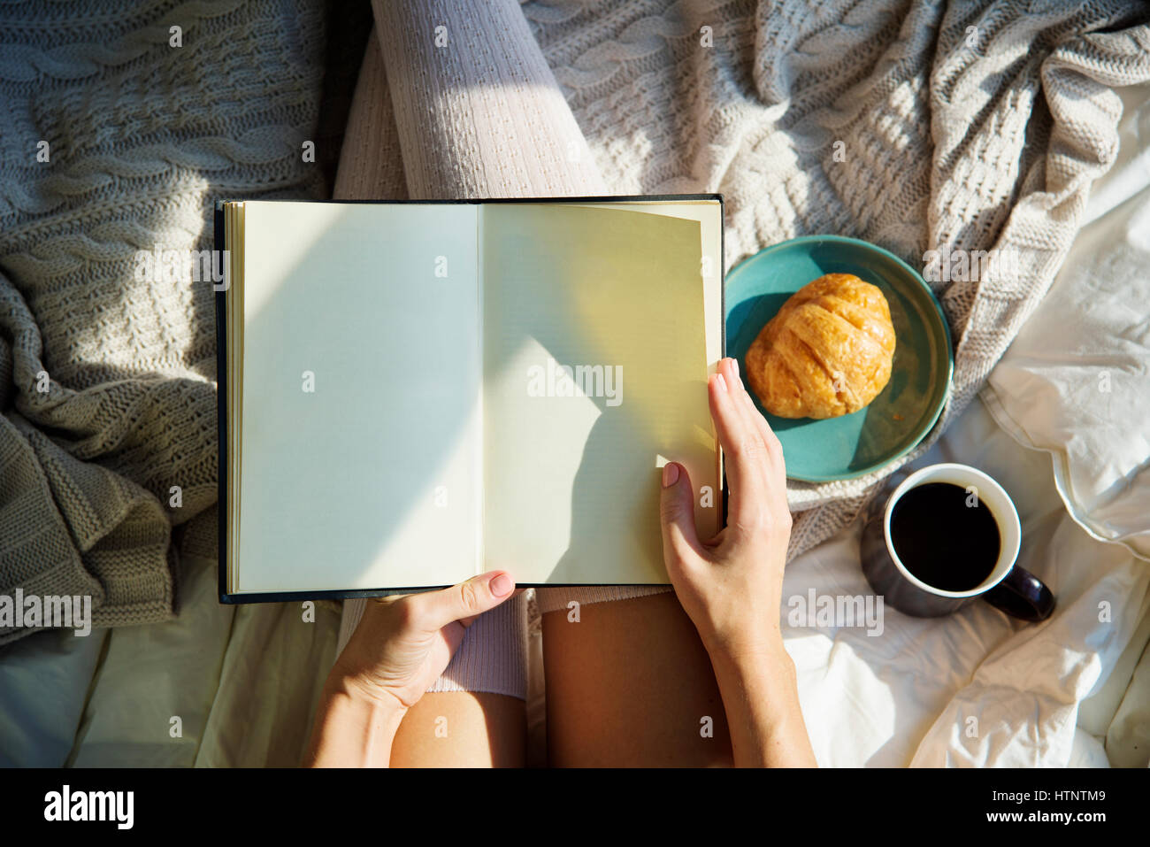 Girl reading morning paper hi-res stock photography and images - Alamy
