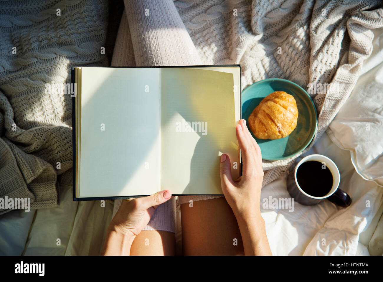 Woman sitting bed aerial hi-res stock photography and images - Alamy