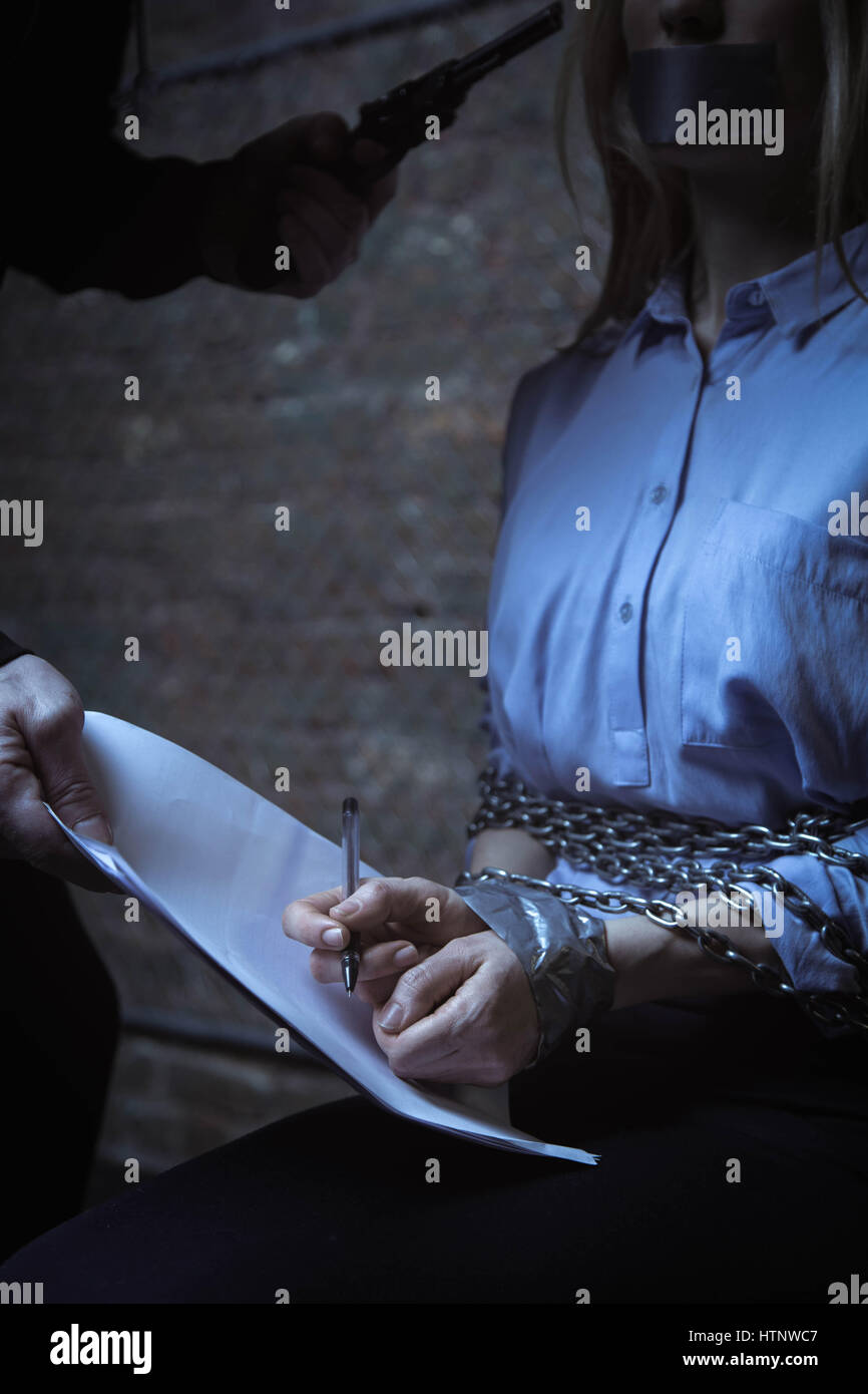 Do it faster. Scared desperate captured woman putting her name down at ...