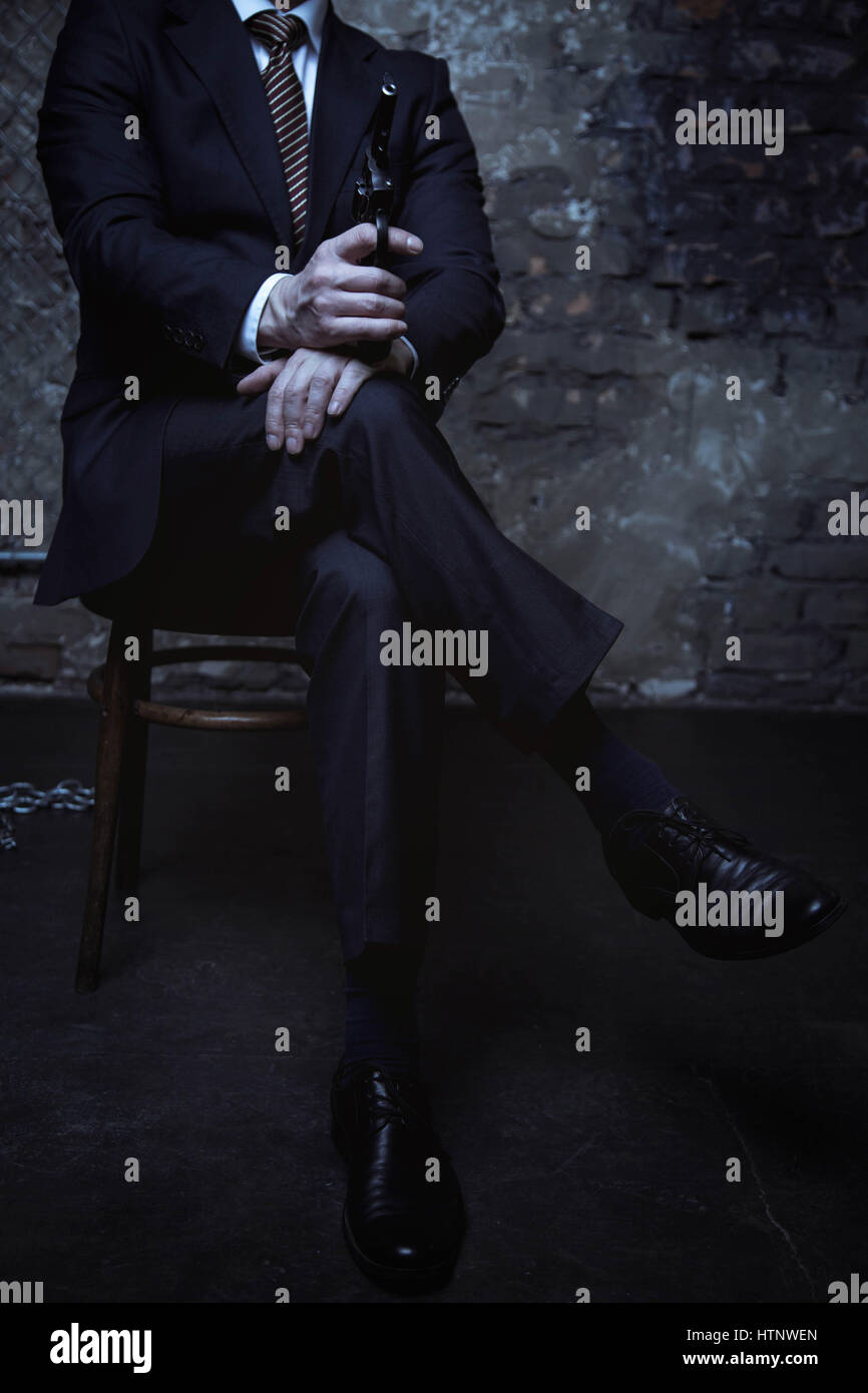 Evil is the new black. Dangerous charming charismatic man pointing a ...