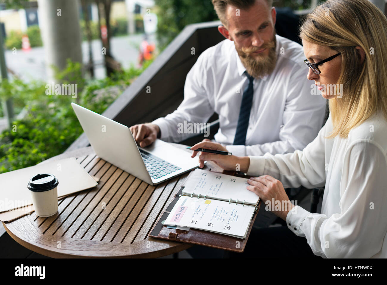 Businesspeople Men Women Notebook Work Stock Photo - Alamy