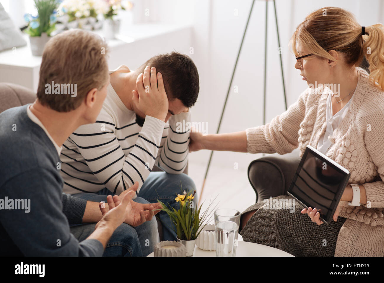 Working with patients. Professional nice female psychologist holding a ...