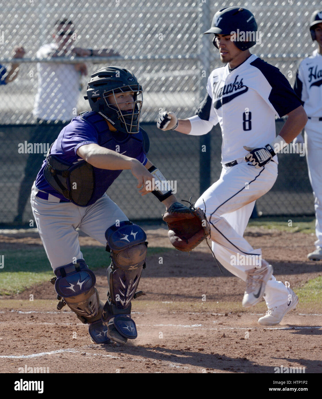 Usa. 13th Mar, 2017. SPORTS -- As Manzano's catcher Zeke Fox waits for ...