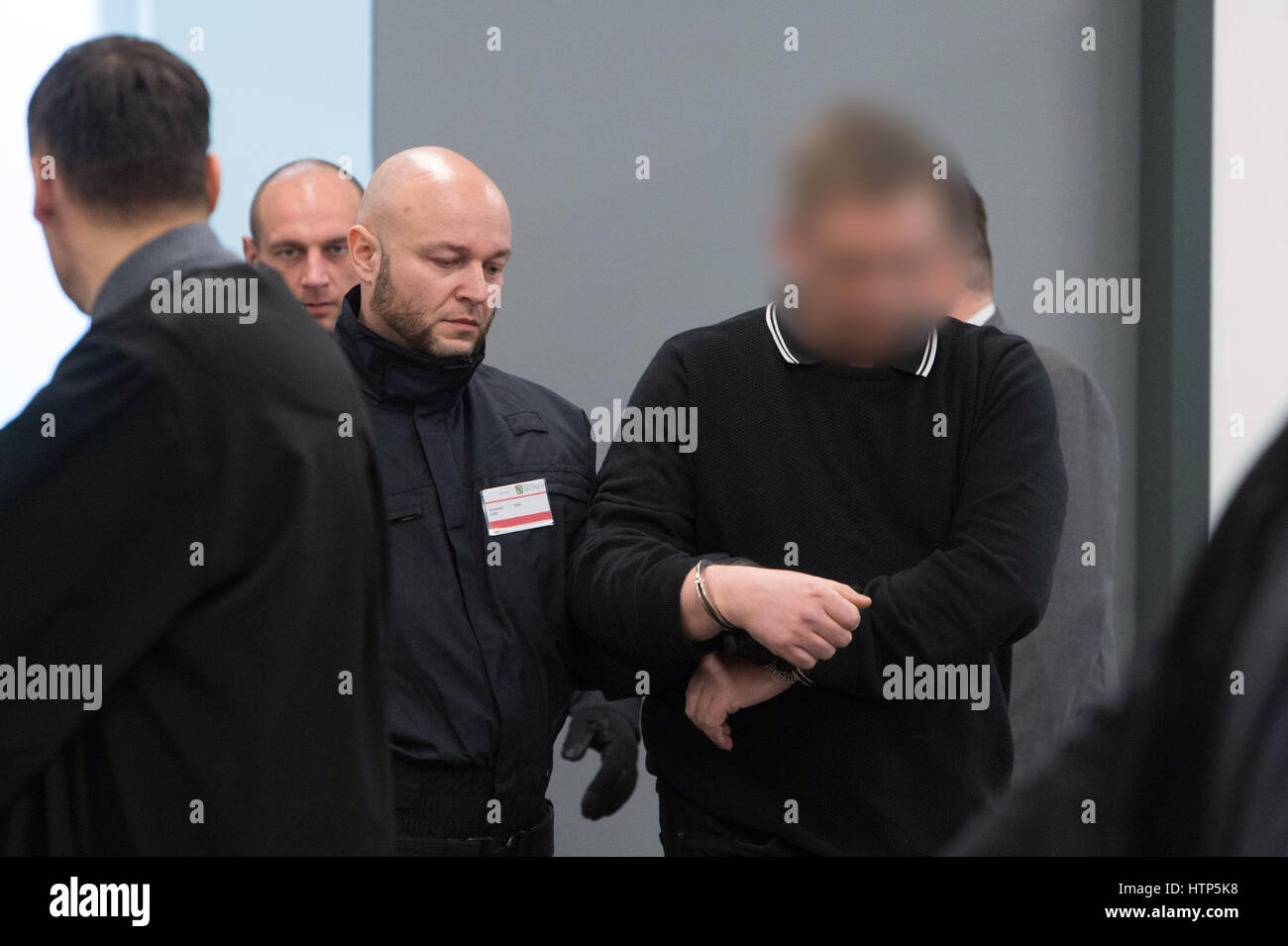 The defendant Rico K. (R.) arrives in the hearing room in the ...