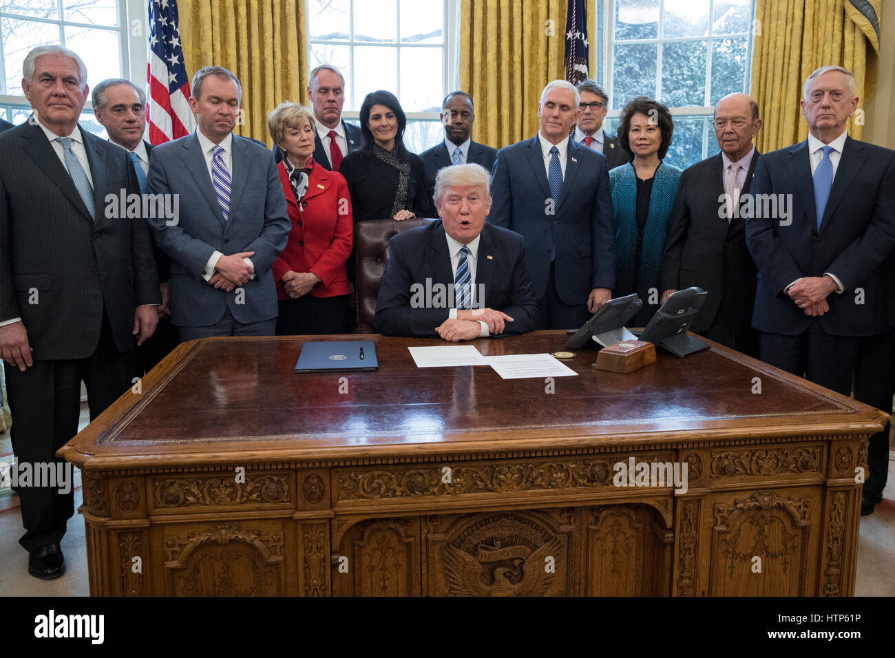 US President Donald J. Trump (C) delivers brief remarks before signing ...