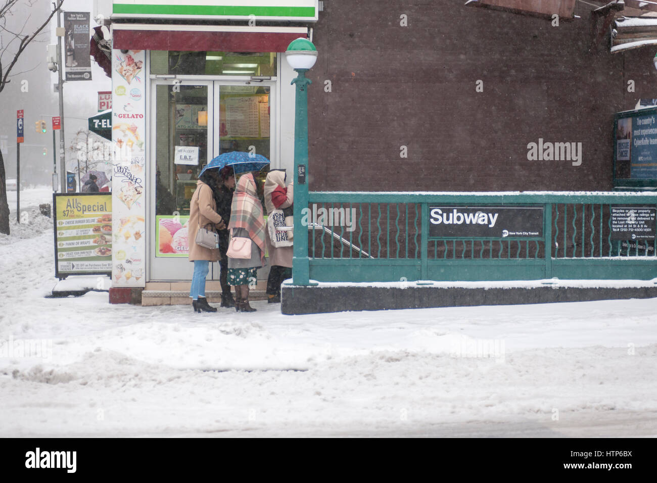 New York, USA. 14th Mar, 2017. Pedestrians prepare to enter the subway ...