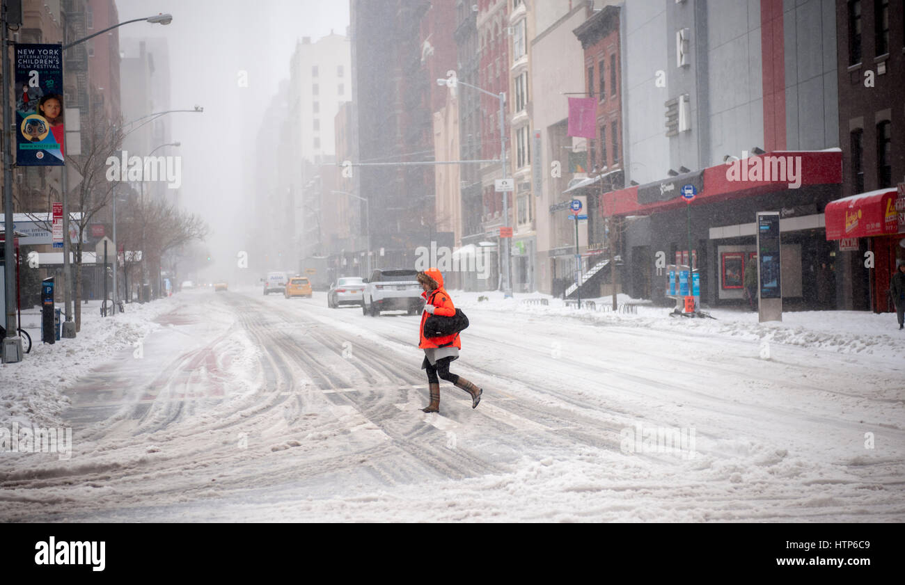 New York, USA. 14th Mar, 2017. Pedestrians trudge through the snow in ...