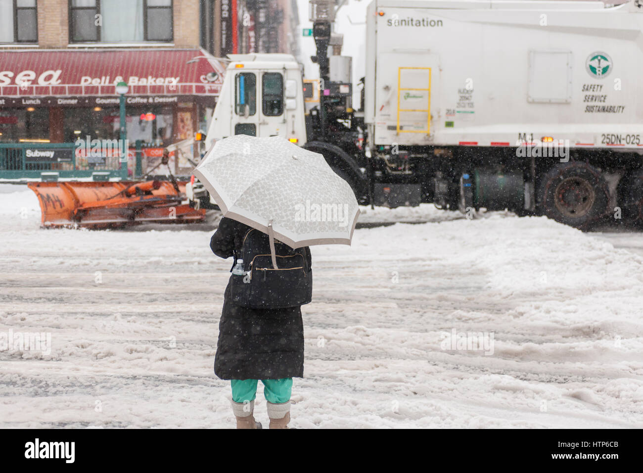 New York, USA. 14th Mar, 2017. Pedestrians trudge through the snow in ...
