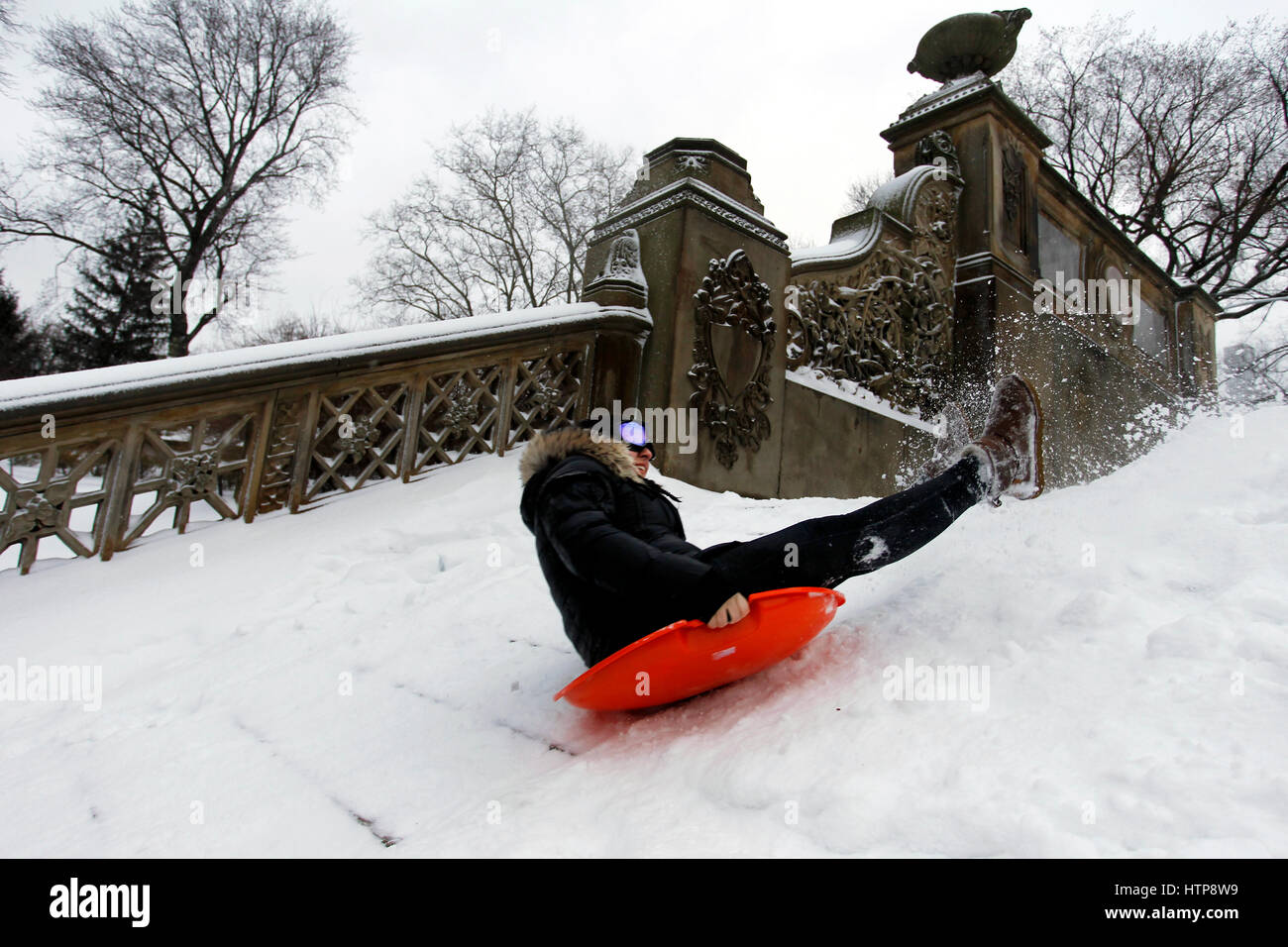 New York, United States. 14th Mar, 2017. Young people sledding on the ...