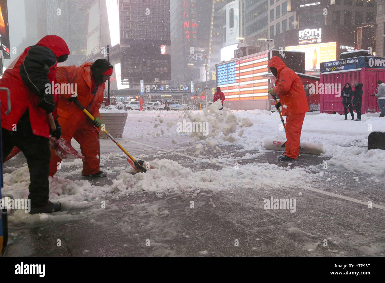 Times Square Alliance workers shovel snow in Times Square during Winter ...