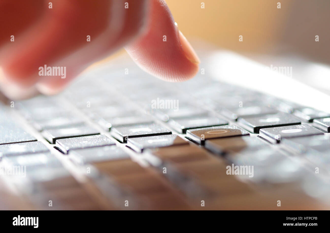 accounting, finger close to press a key Stock Photo - Alamy