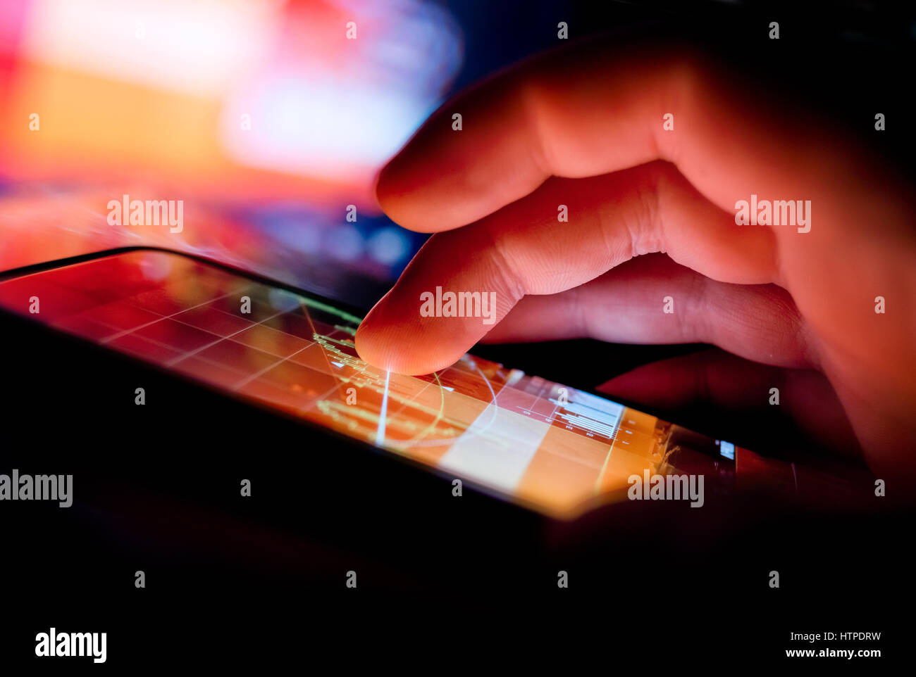 A Person using a portable device to display business data. Mobile ...