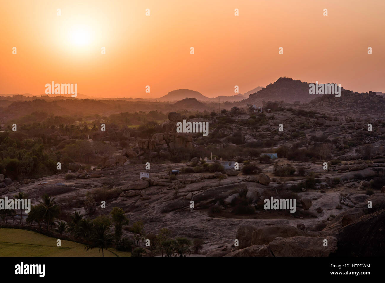 Sun setting over Hampi from viewpoint Stock Photo - Alamy