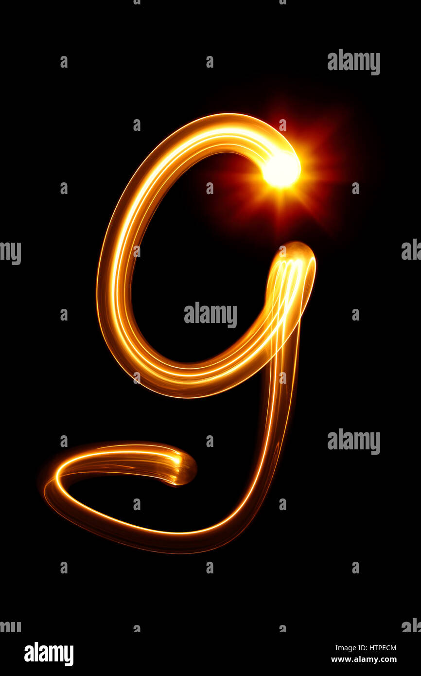 G - Created by light alphabet over black background Stock Photo - Alamy