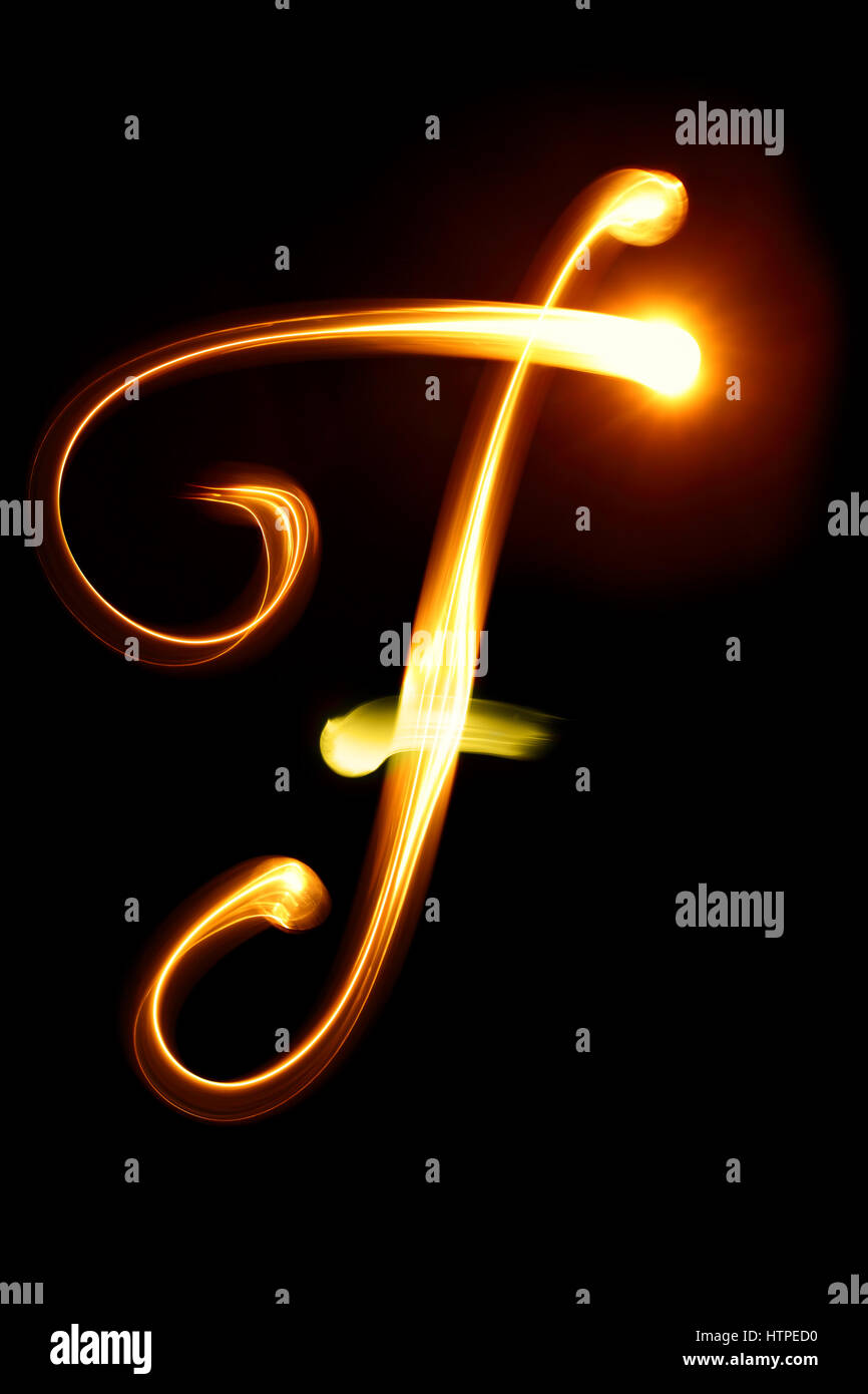 F - Created by light alphabet over black background Stock Photo - Alamy