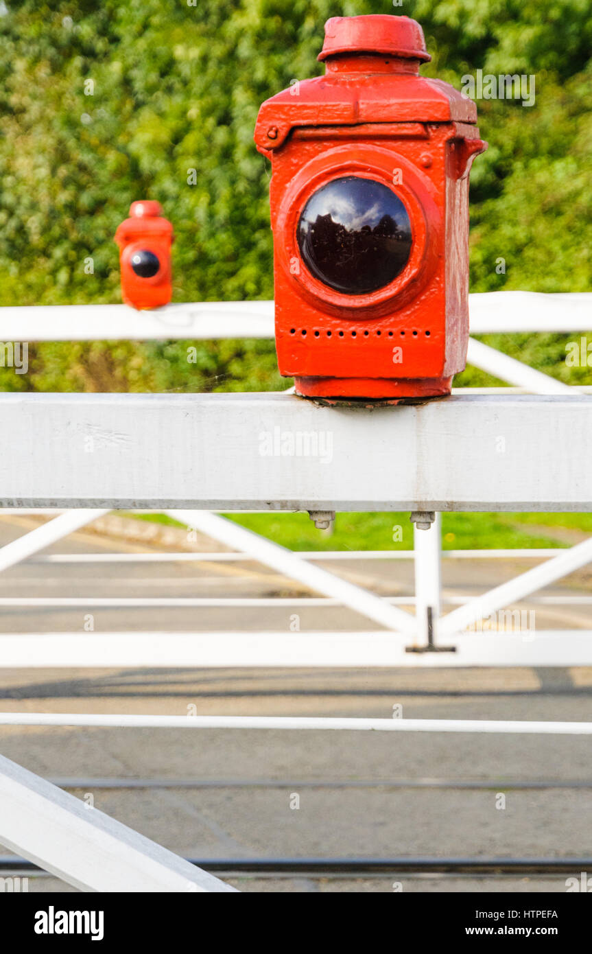 Warning lamps on a gated railway level crossing Stock Photo - Alamy