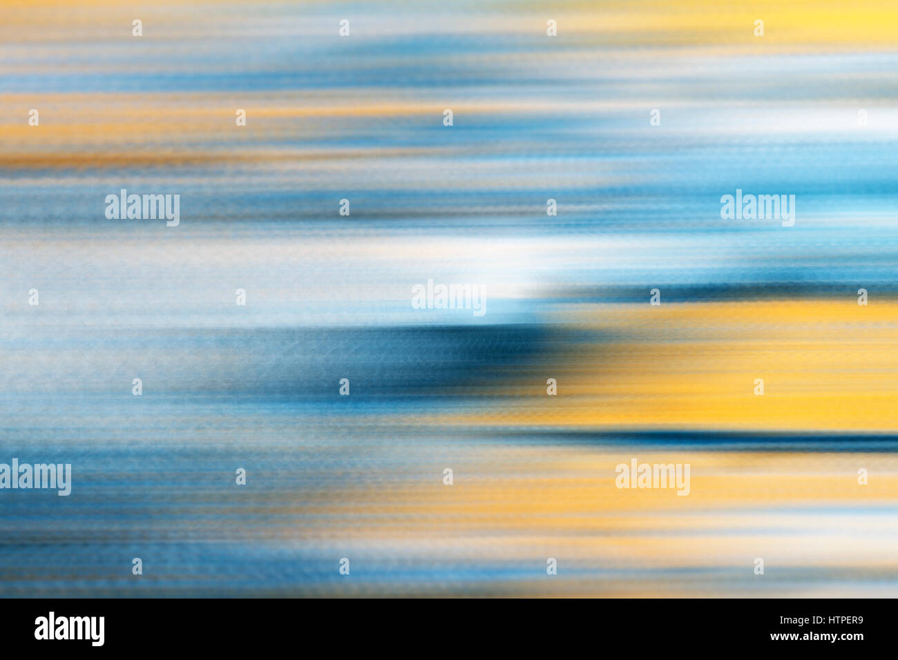 Blue yellow horizontal motion blur background Stock Photo - Alamy