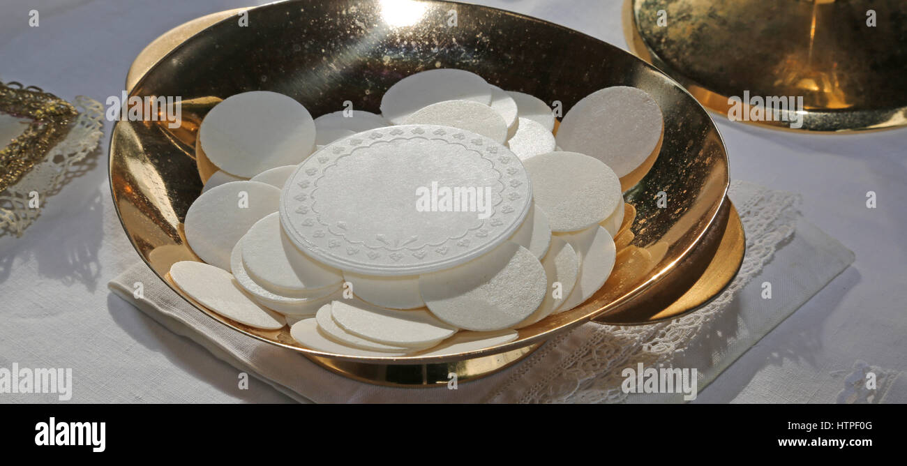 many consecrated Host during the Mass of first communion Stock Photo ...