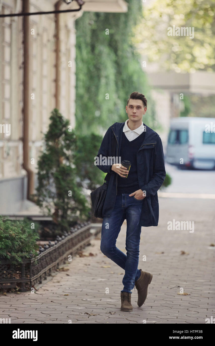 Hipster man walking in the streets of old city in eastern europe Stock ...