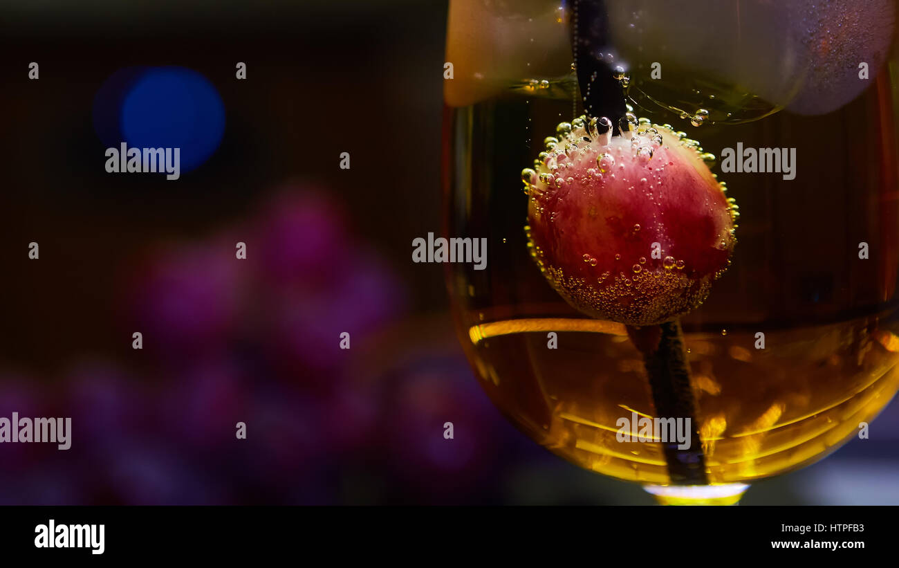 Grapes floating in champagne creating lots of bubbles Stock Photo - Alamy