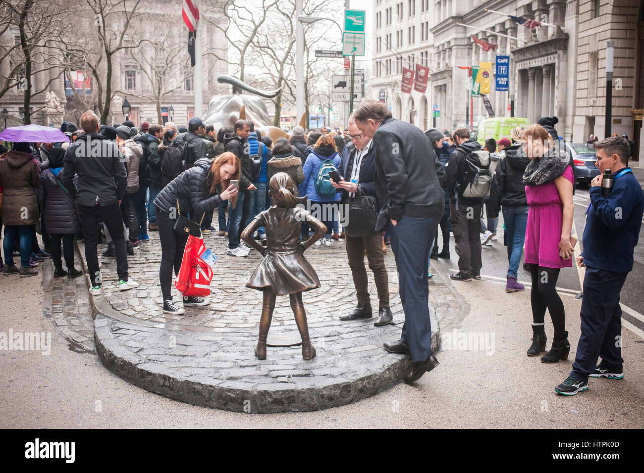The bronze statue, "The Fearless Girl" by the artist Kristen Visbal ...