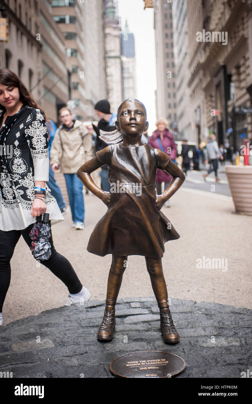 The bronze statue, "The Fearless Girl" by the artist Kristen Visbal ...