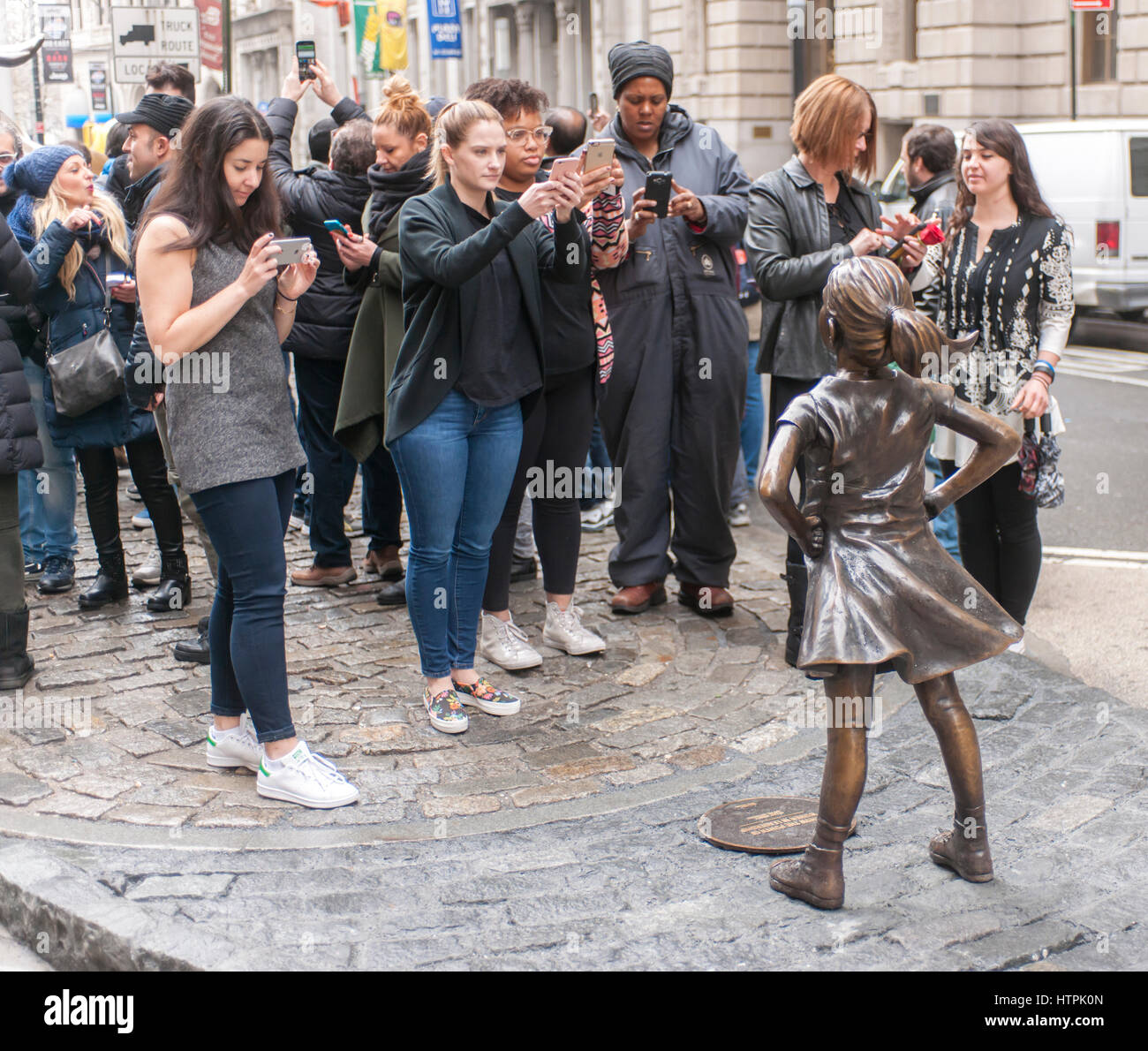 The bronze statue, "The Fearless Girl" by the artist Kristen Visbal ...