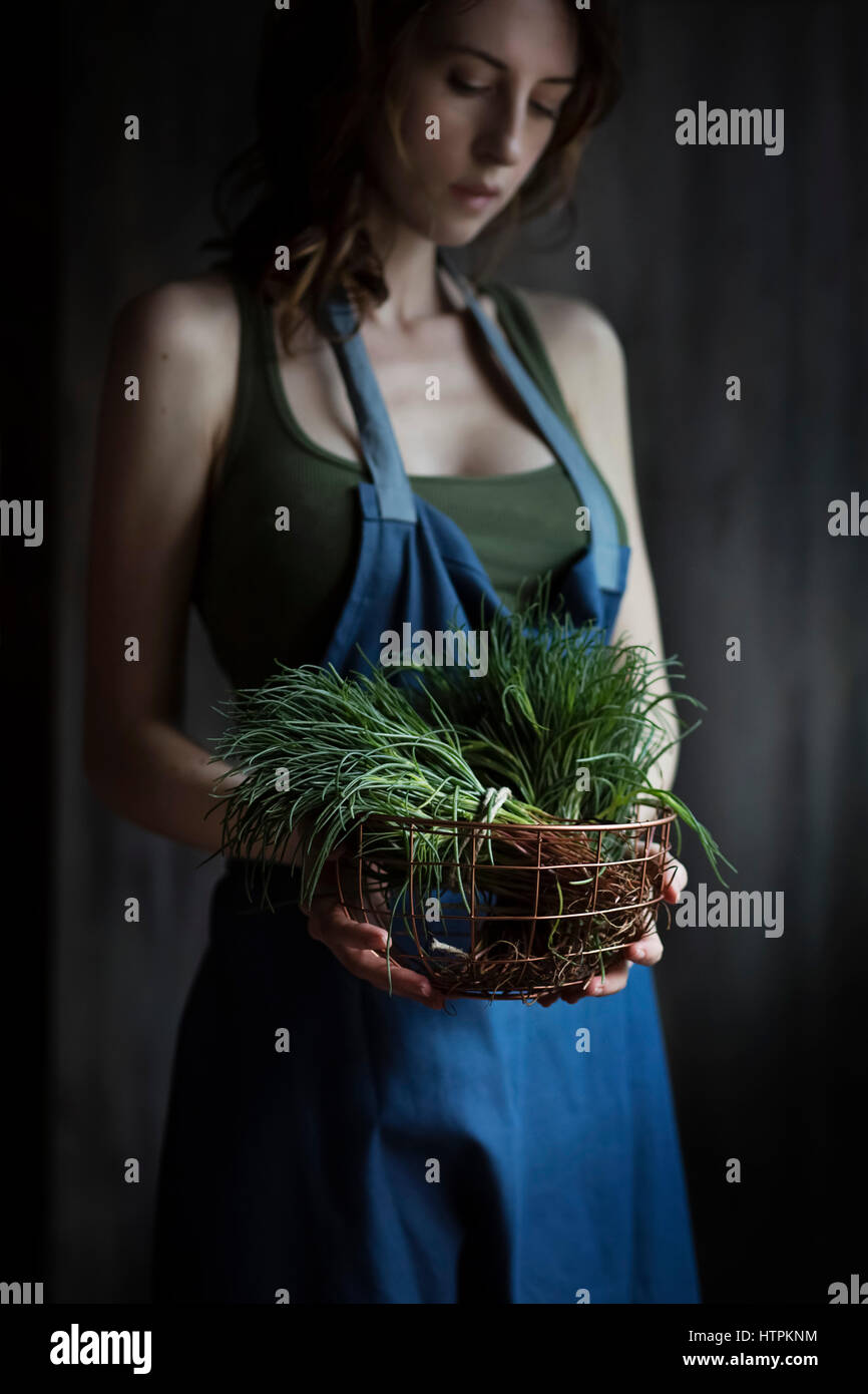Woman holding agretti, a typical italian spring vegetables Stock Photo ...