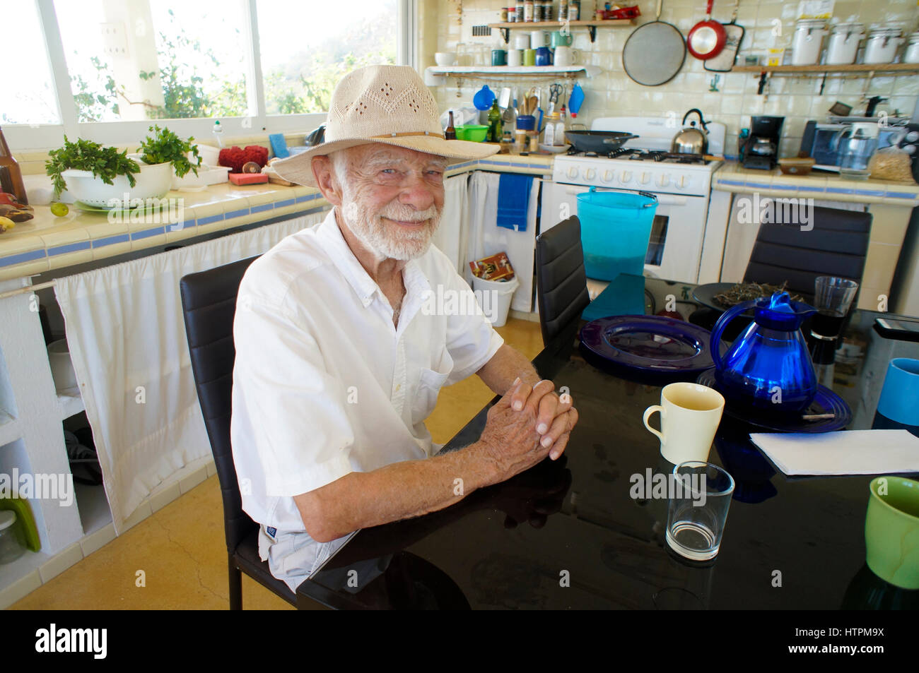 happy elderly man in kitchen Stock Photo - Alamy