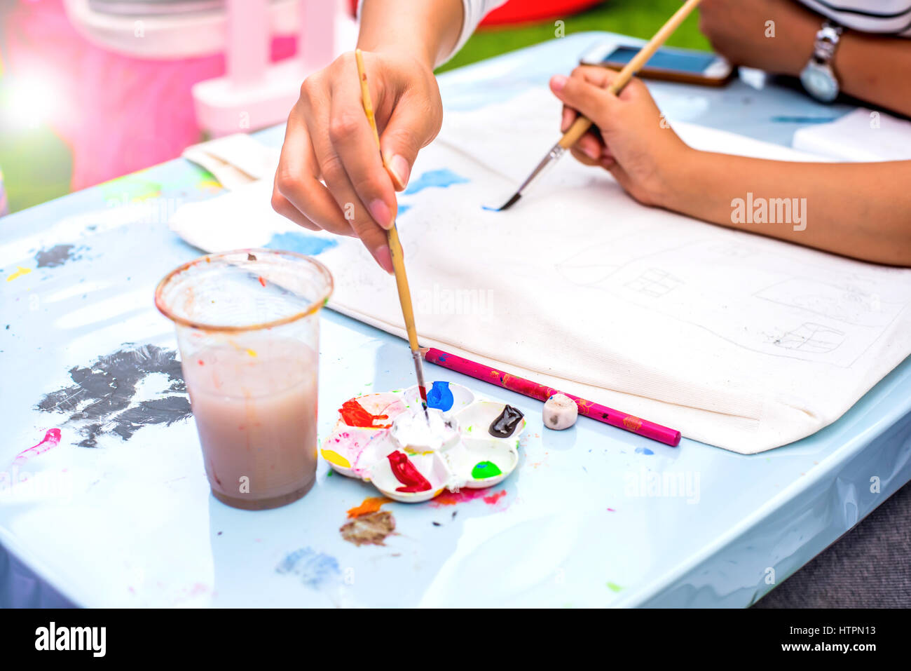 Education, Mixing Water Colors in a painting Class Stock Photo - Alamy