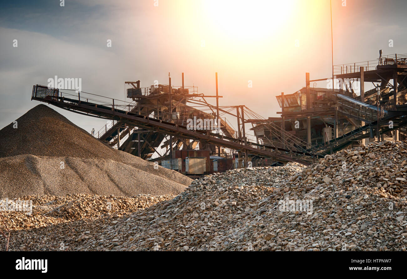 conveyors in a stone quarry at sunset Stock Photo - Alamy