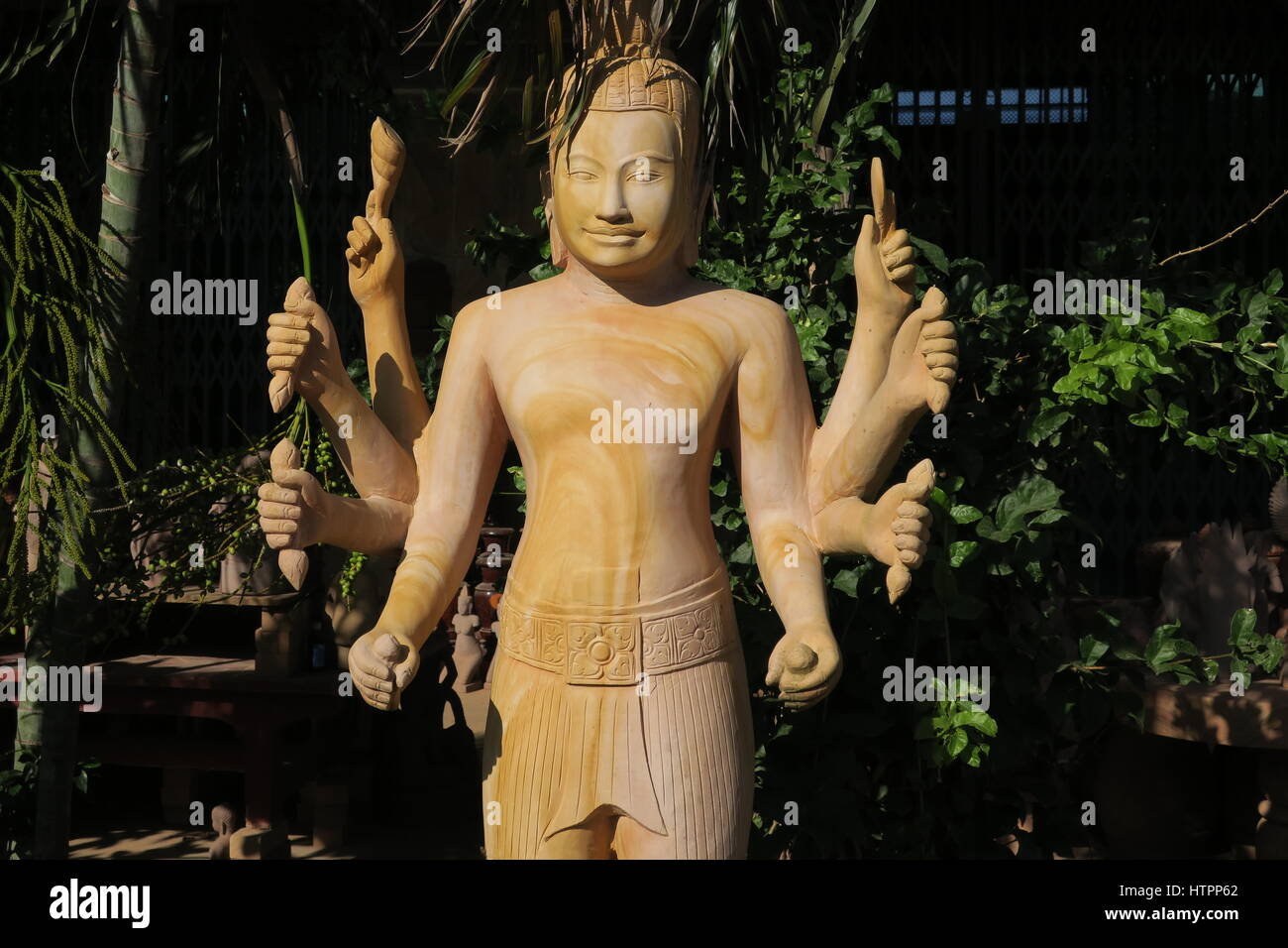 Nice statue of bodhisattva with four pairs of arms Stock Photo - Alamy