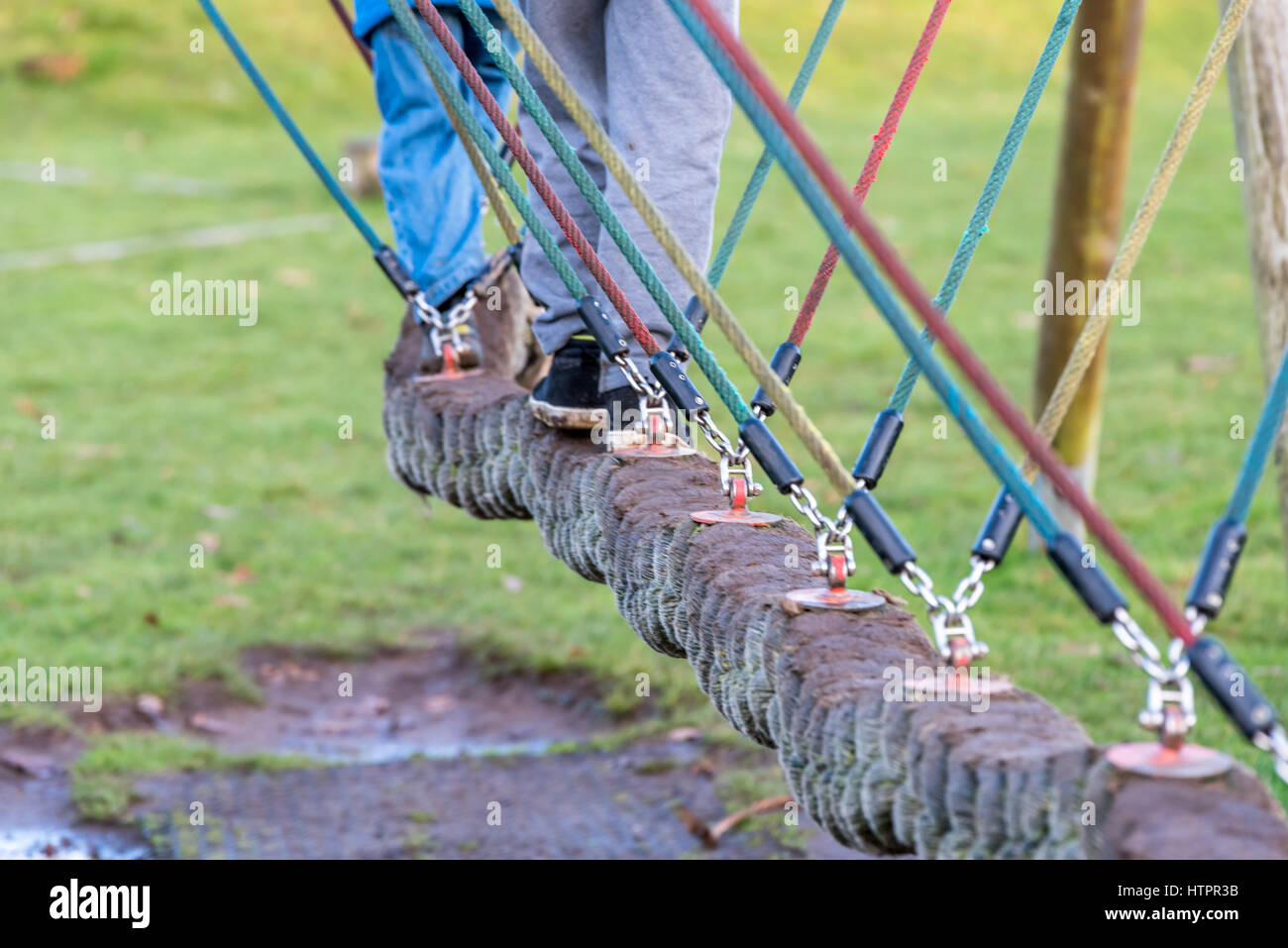 Swinging snake at children playground in spring Stock Photo - Alamy