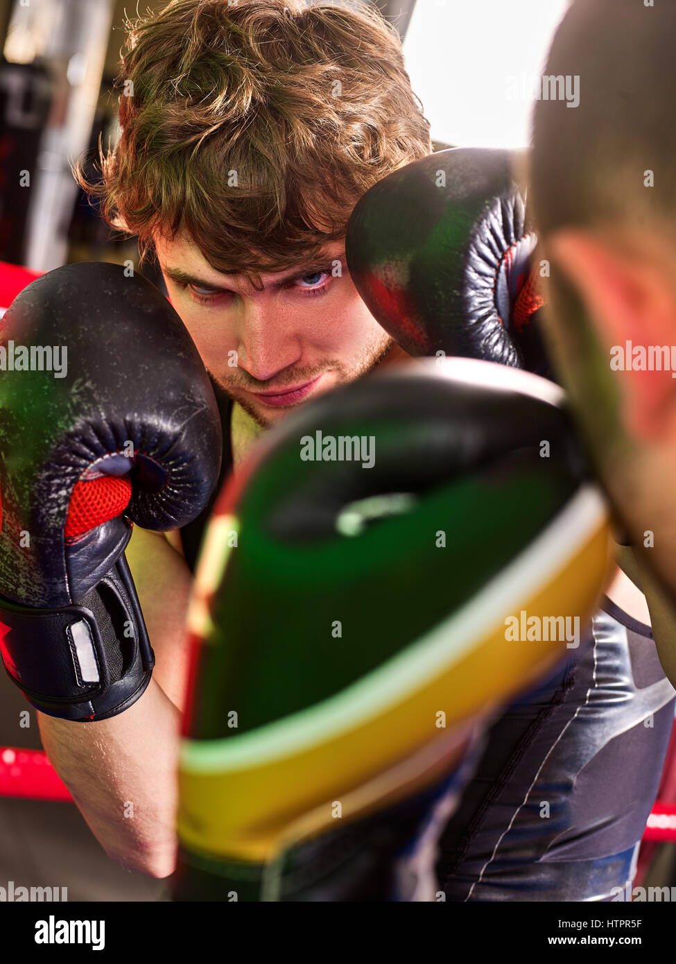 Two men boxer wearing helmet boxing indoor Stock Photo - Alamy