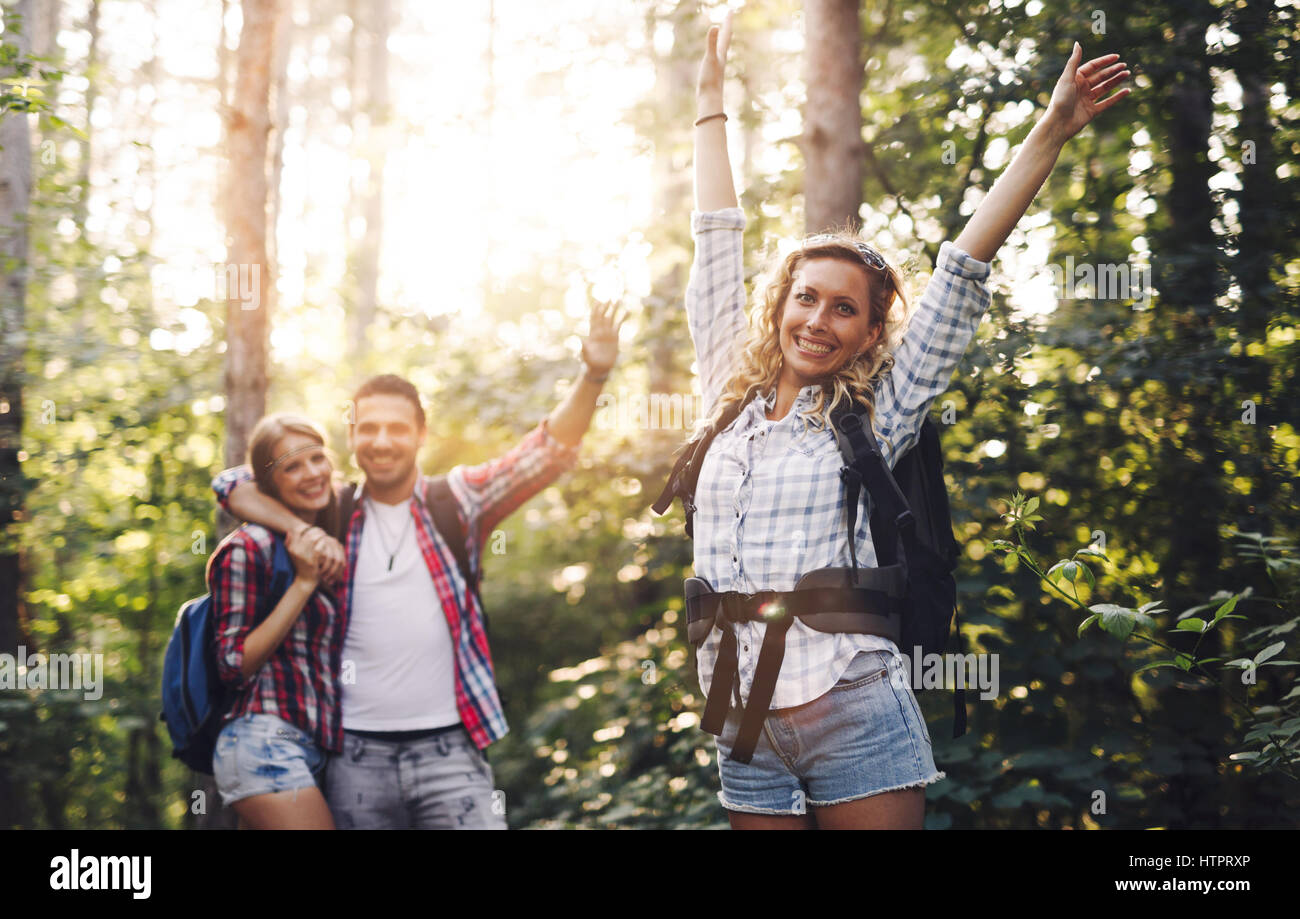 Beautiful woman and friends hiking and backpacking in forest Stock ...