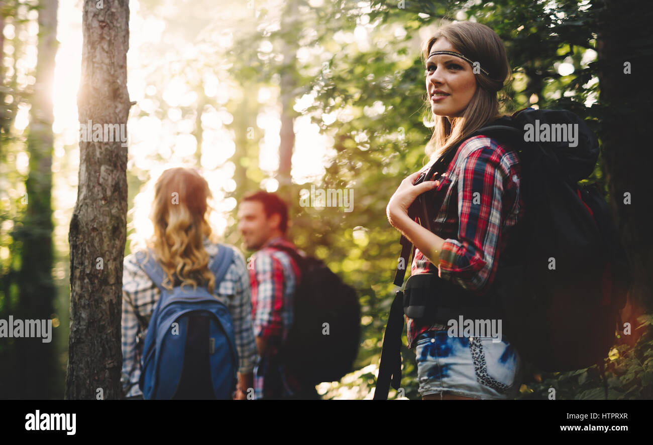 Group of backpacking hikers friends going for forest trekking Stock ...