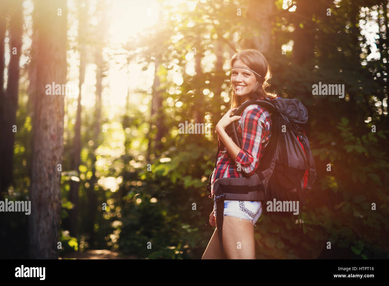 Female backpacker set out on forest hike advanture Stock Photo - Alamy