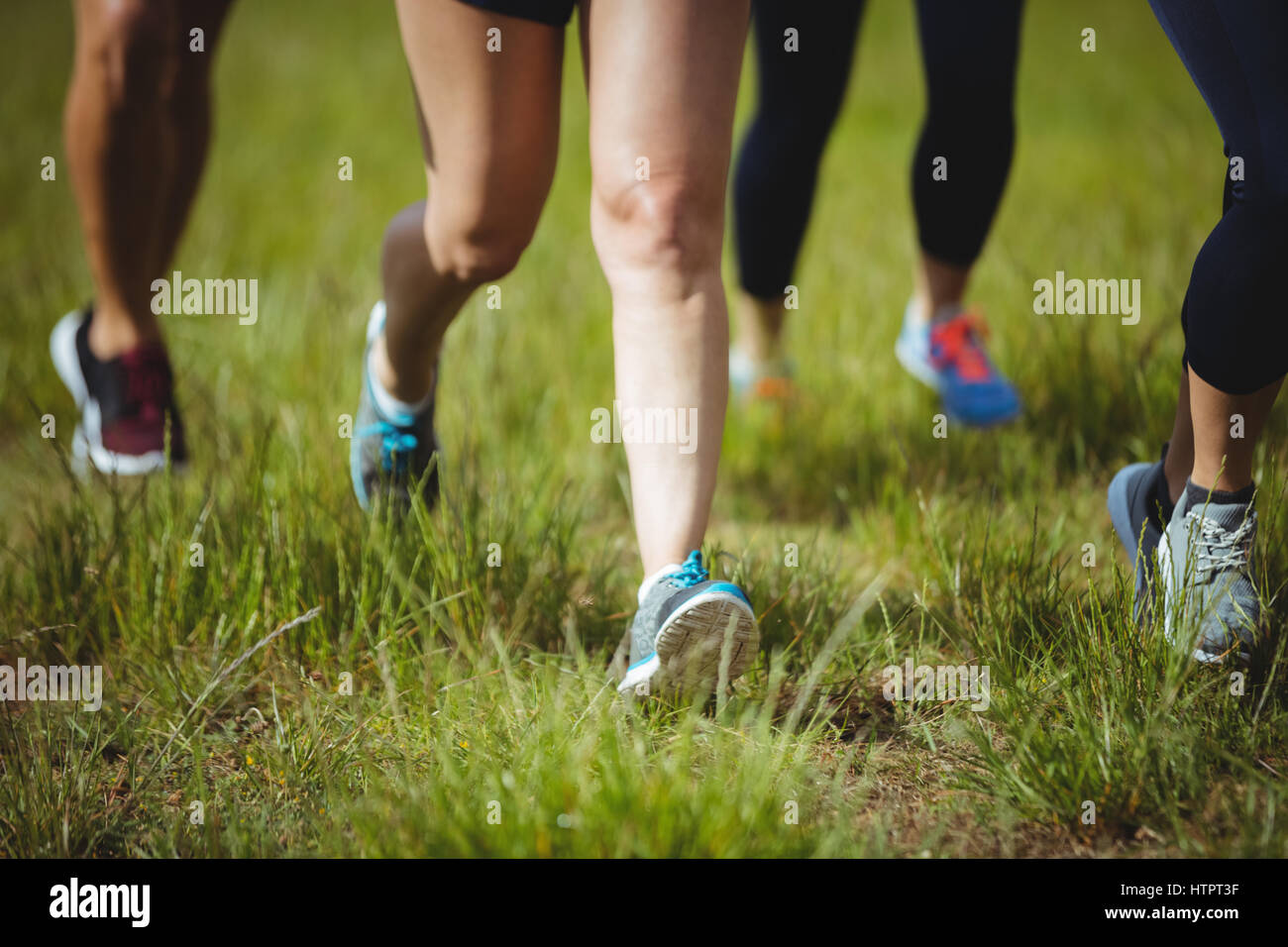 Woman running in boot camp hi-res stock photography and images - Alamy