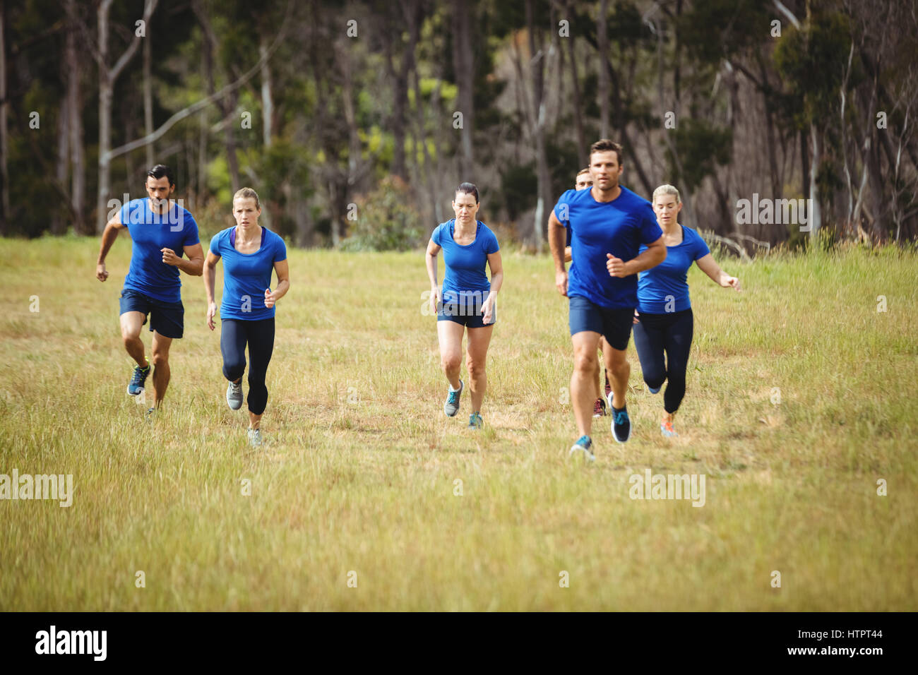 Woman running in boot camp hi-res stock photography and images - Alamy