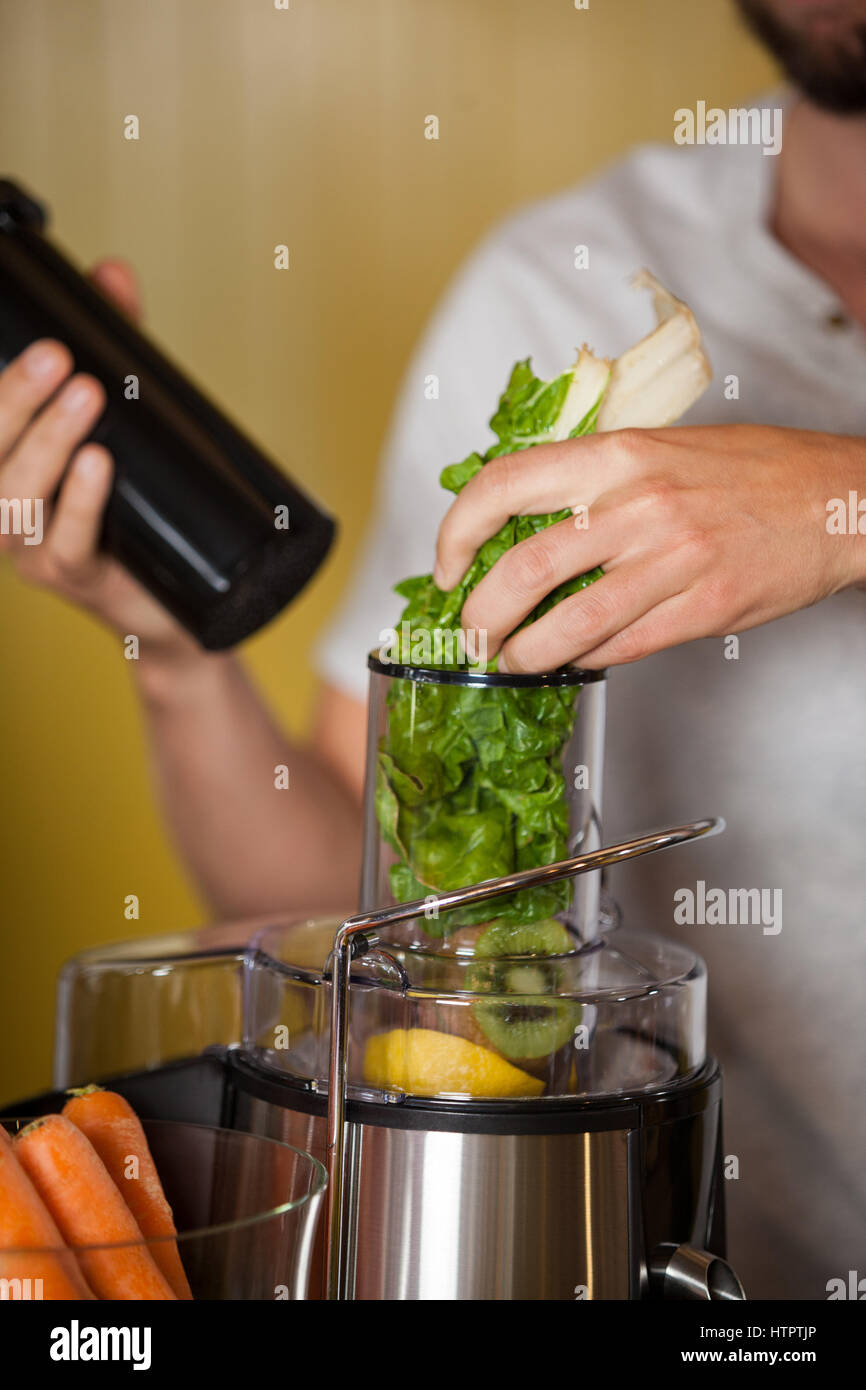Male staff preparing a juice at health grocery shop Stock Photo - Alamy