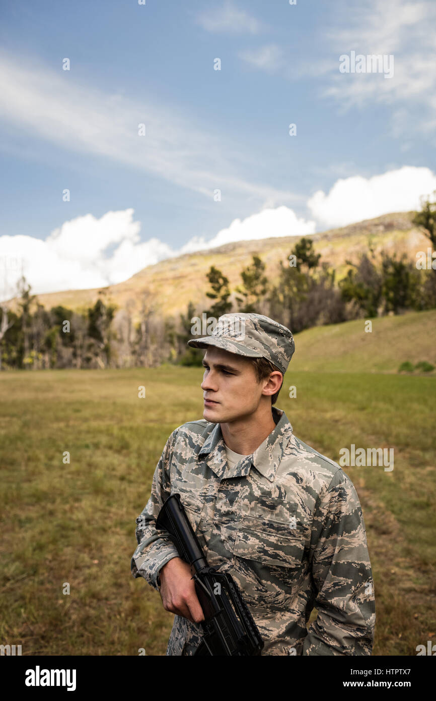 Military soldier guarding with a rifle in a boot camp Stock Photo - Alamy