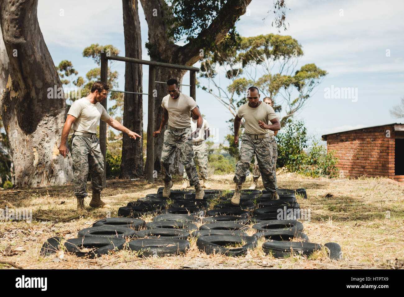 Trainer giving training to military soldiers at boot camp Stock Photo ...