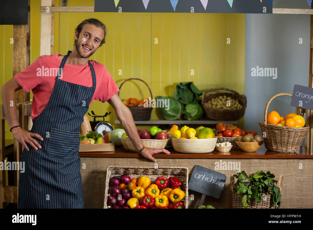Portrait of male staff standing in organic section of supermarket Stock ...