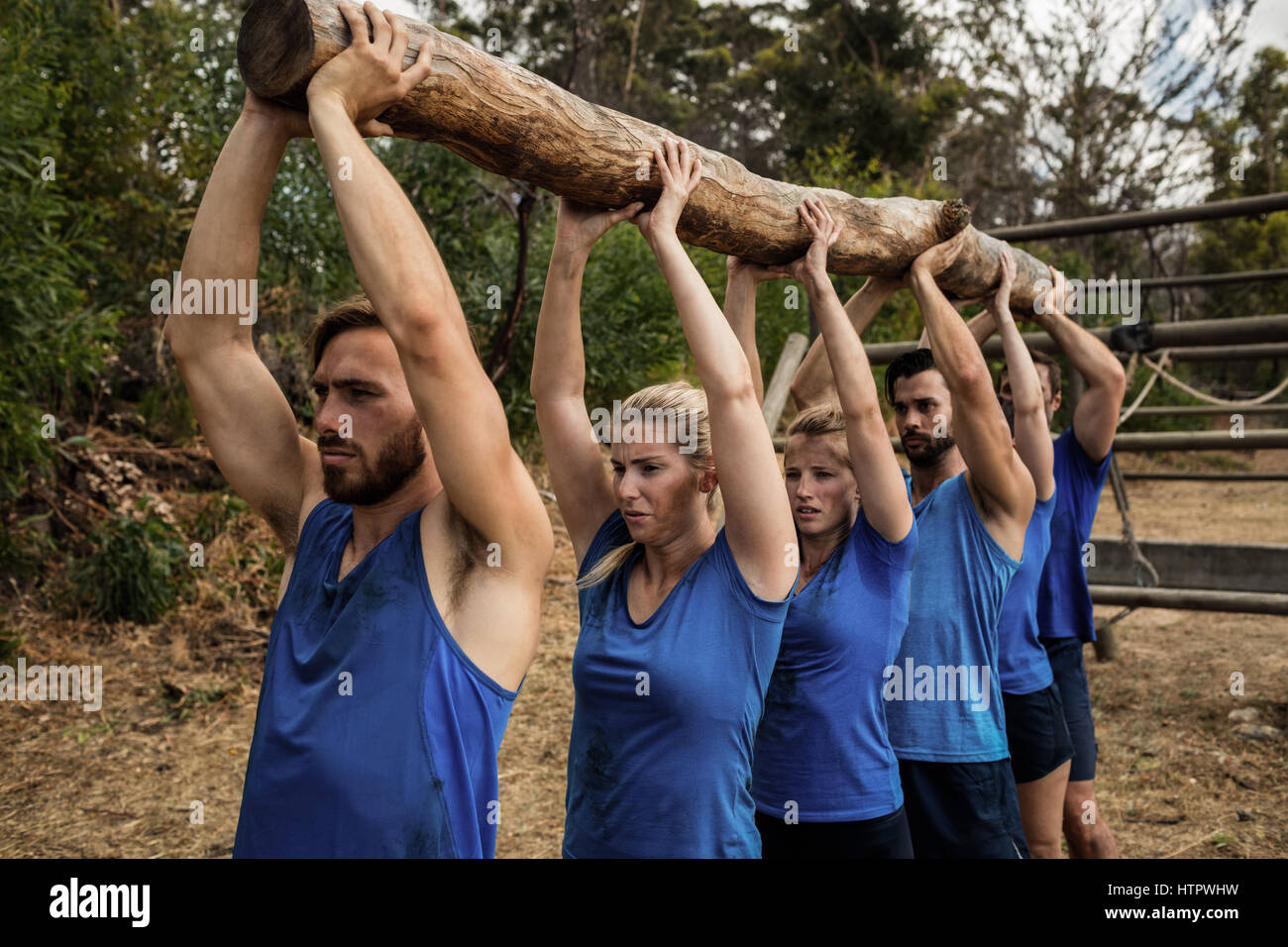 Woman carrying heavy wooden log hi-res stock photography and images - Alamy