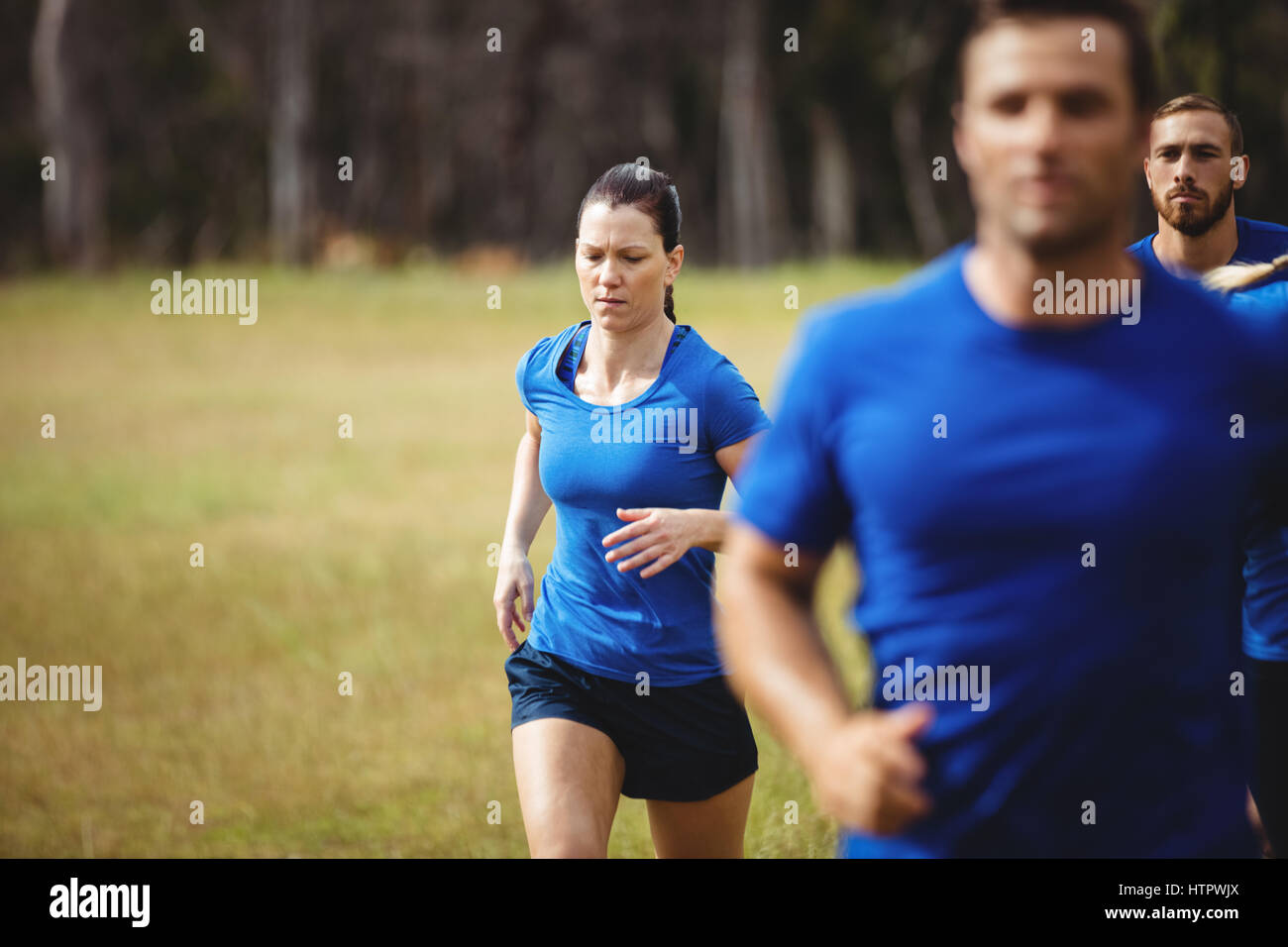 Woman running in boot camp hi-res stock photography and images - Alamy