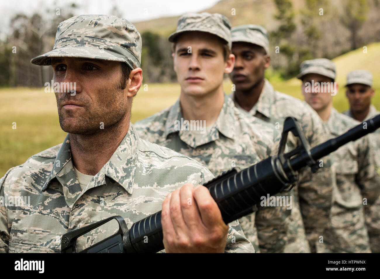 Group of military soldiers standing in line at boot camp Stock Photo ...
