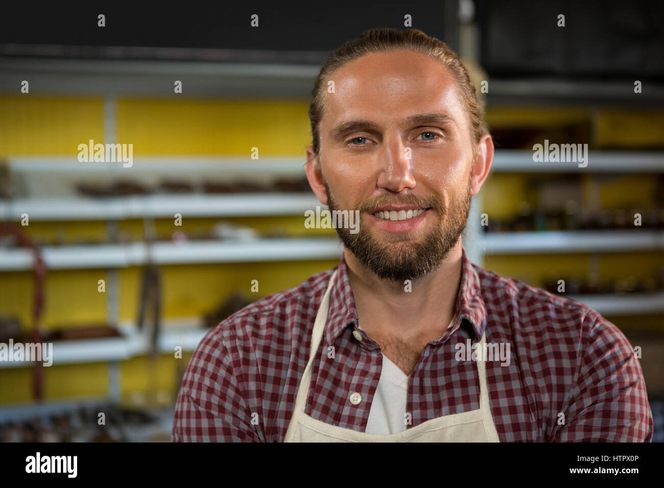 Portrait of confident male staff in market Stock Photo - Alamy