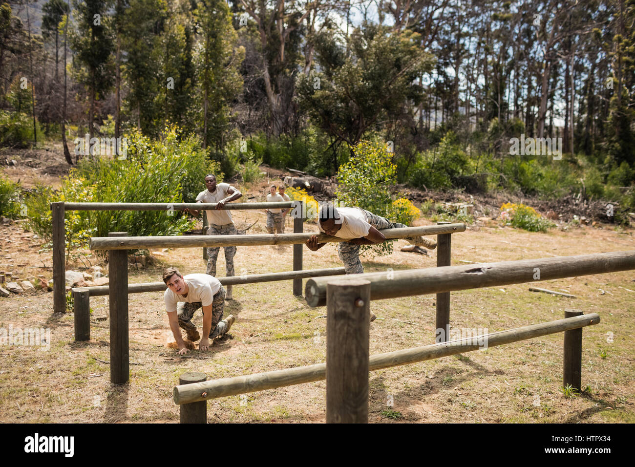 Military soldiers training on fitness trail at boot camp Stock Photo ...